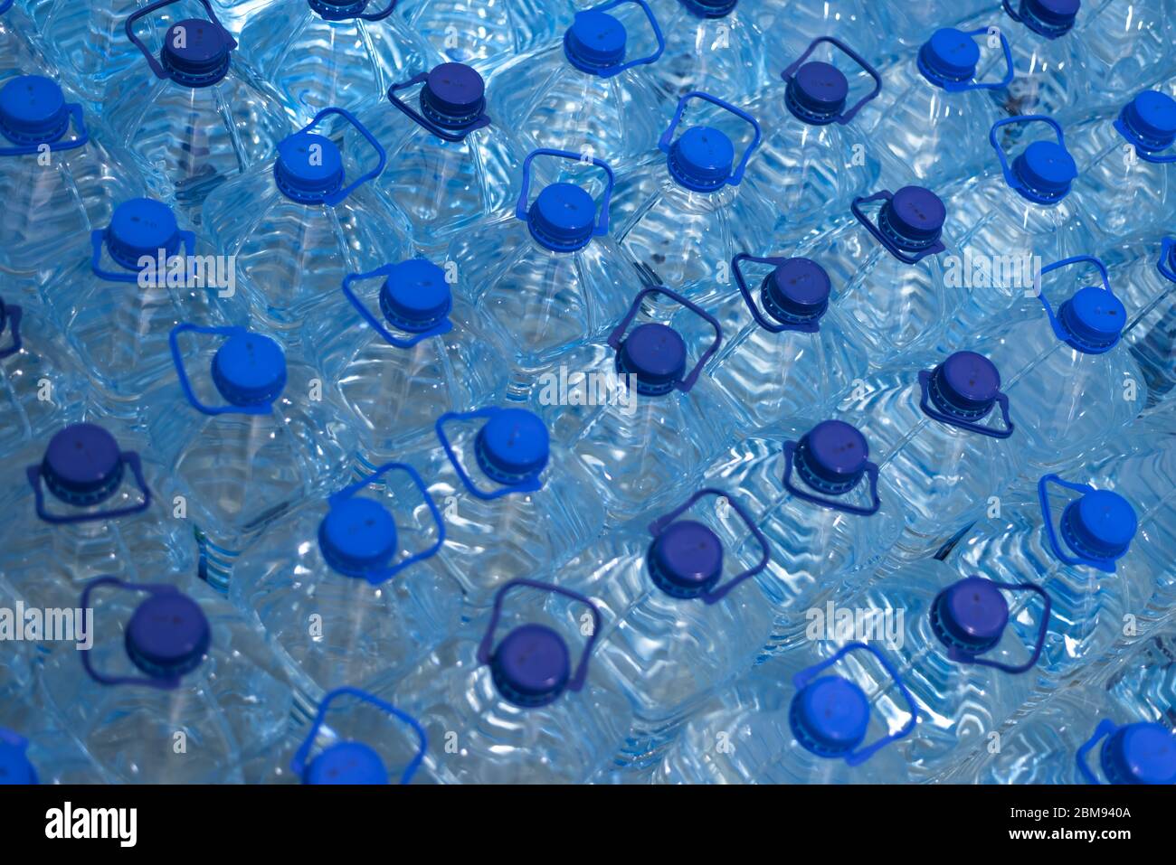 Lot of bottles worth with clean cool natural water. Group of plastic ...
