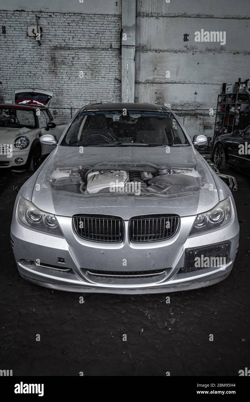 Disassembled old car in garage. Internal combustion engine, car parts ...