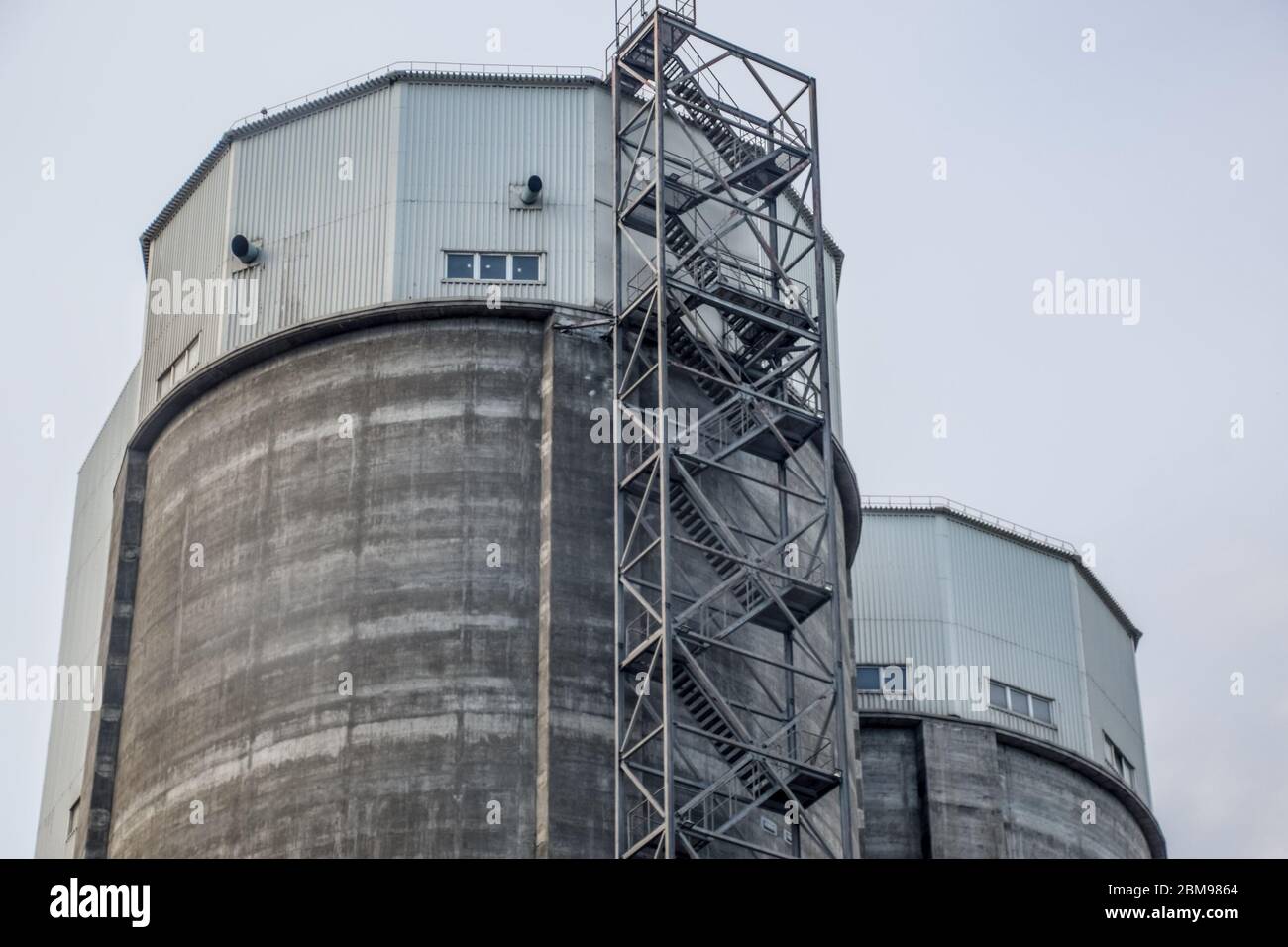 Staircase to the tower of a cement plant. Industry building Stock Photo ...