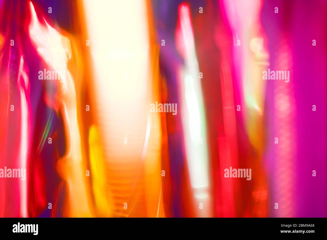 Abstract intense party background of vertical lens blur light streaks ...