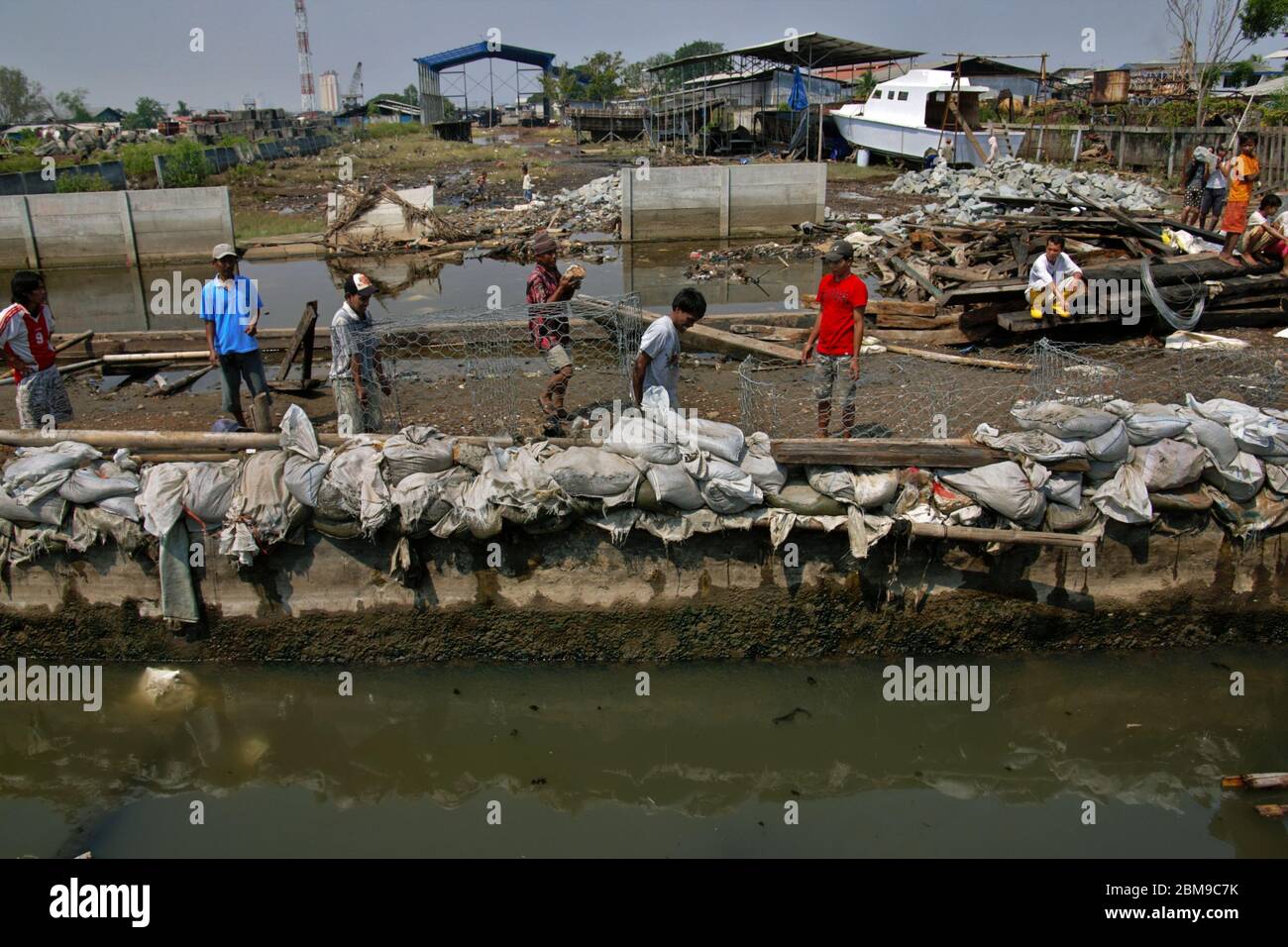 Residents of Muara Baru village in Jakarta coastal area working ...