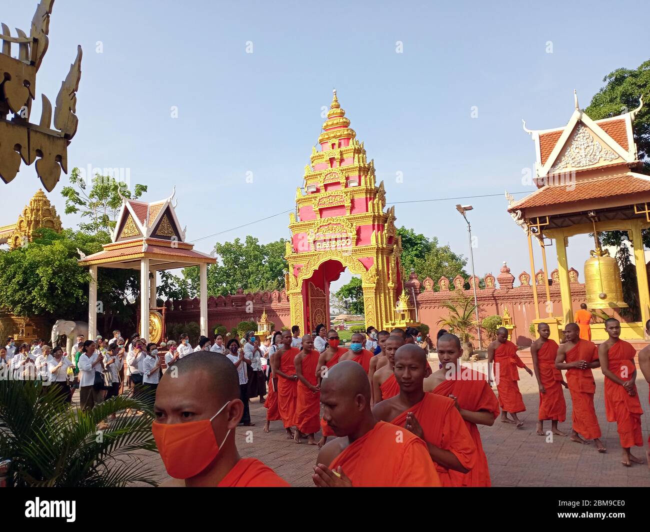 Phnom Penh, Cambodia. 06th May, 2020. Buddhist monks line up with ...