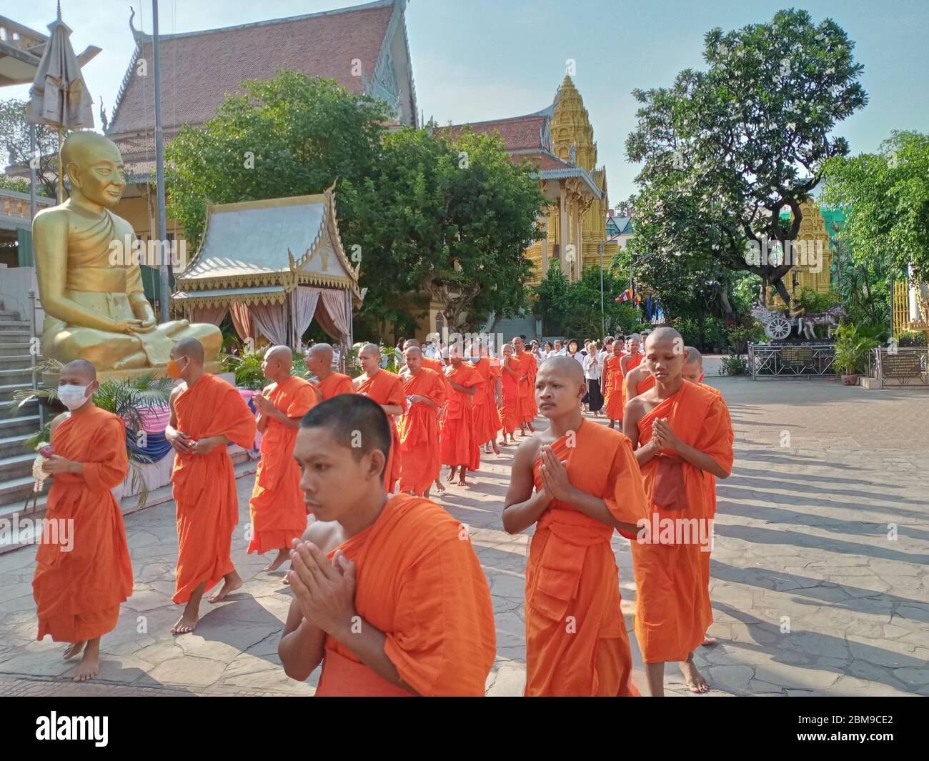 Phnom Penh, Cambodia. 06th May, 2020. Buddhist monks line up with ...
