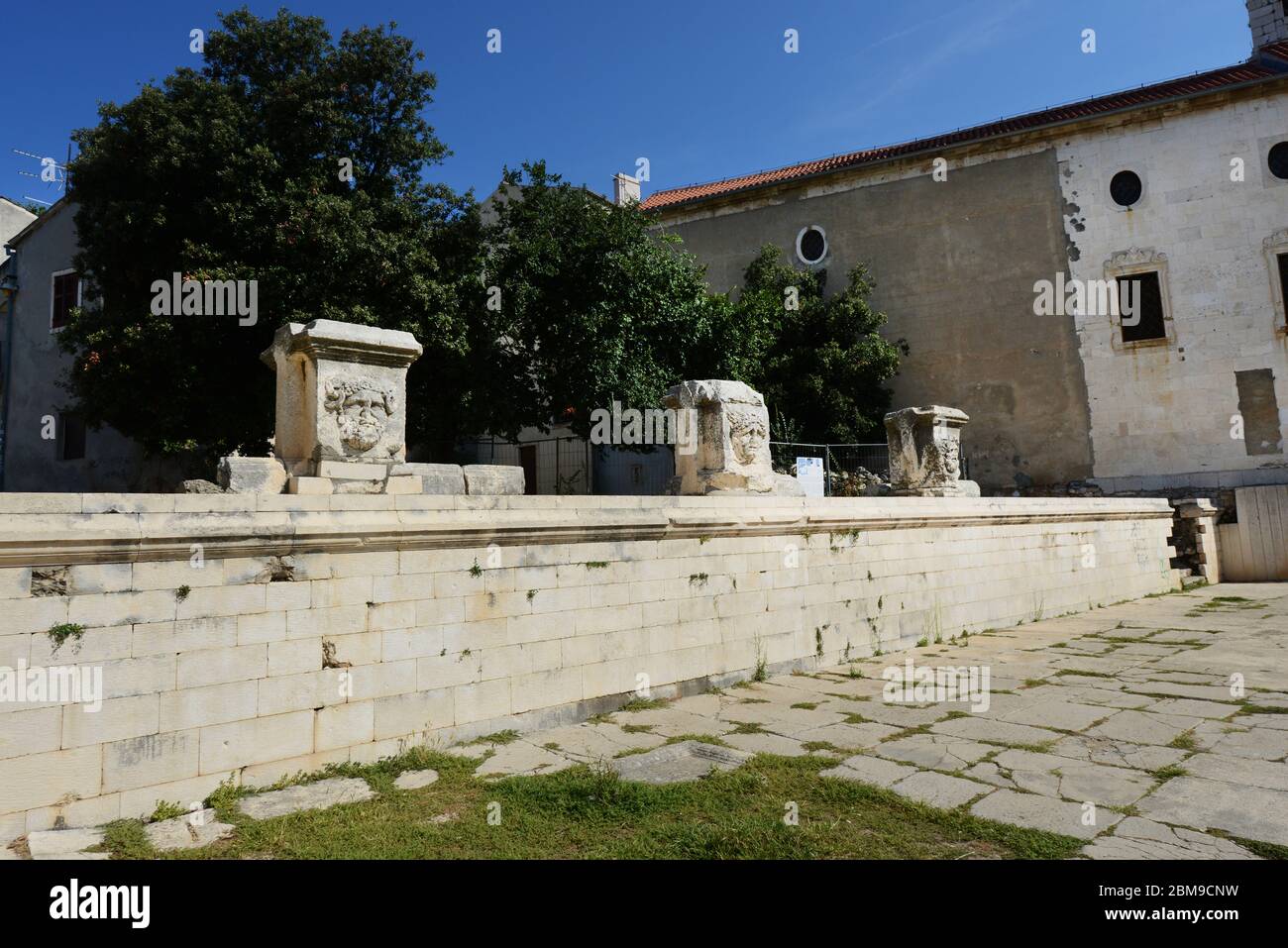 Carved Roman face reliefs at the Roman forum in Zadar, Croatia Stock ...