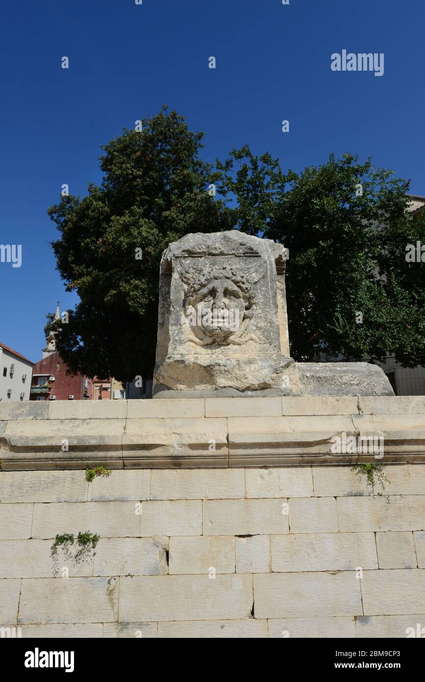 Carved Roman face reliefs at the Roman forum in Zadar, Croatia Stock ...