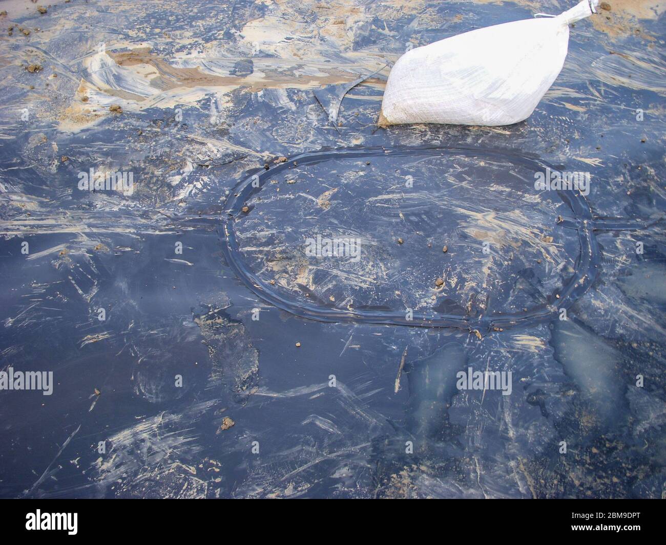 Destructive patch on an HDPE synthetic geomembrane liner at a landfill ...