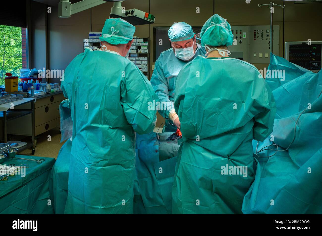 a surgical team performs a surgical abdominal operation Stock Photo - Alamy