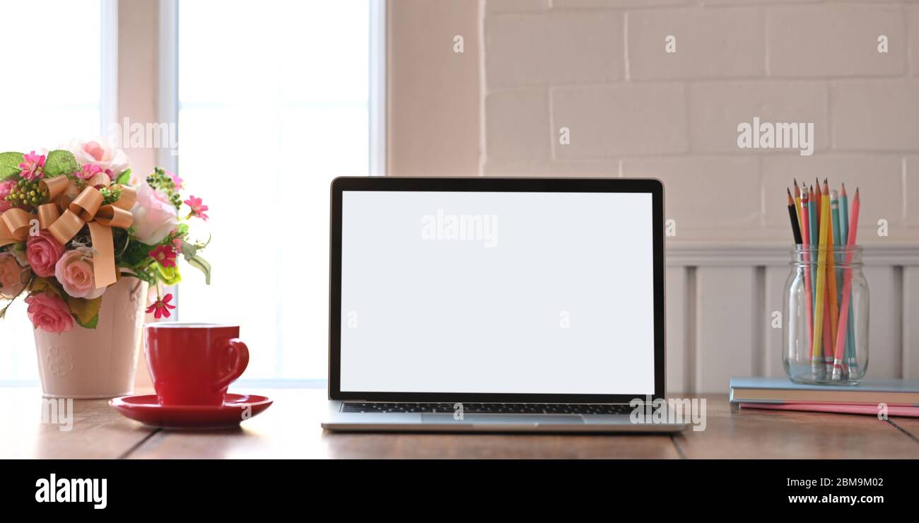 Photo of computer laptop with white blank screen putting on wooden ...
