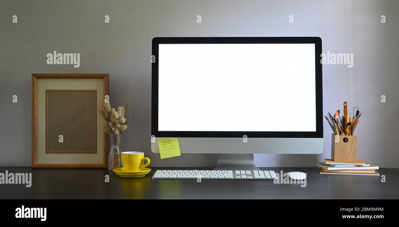 Photo of Workspace blank screen computer monitor putting on working ...