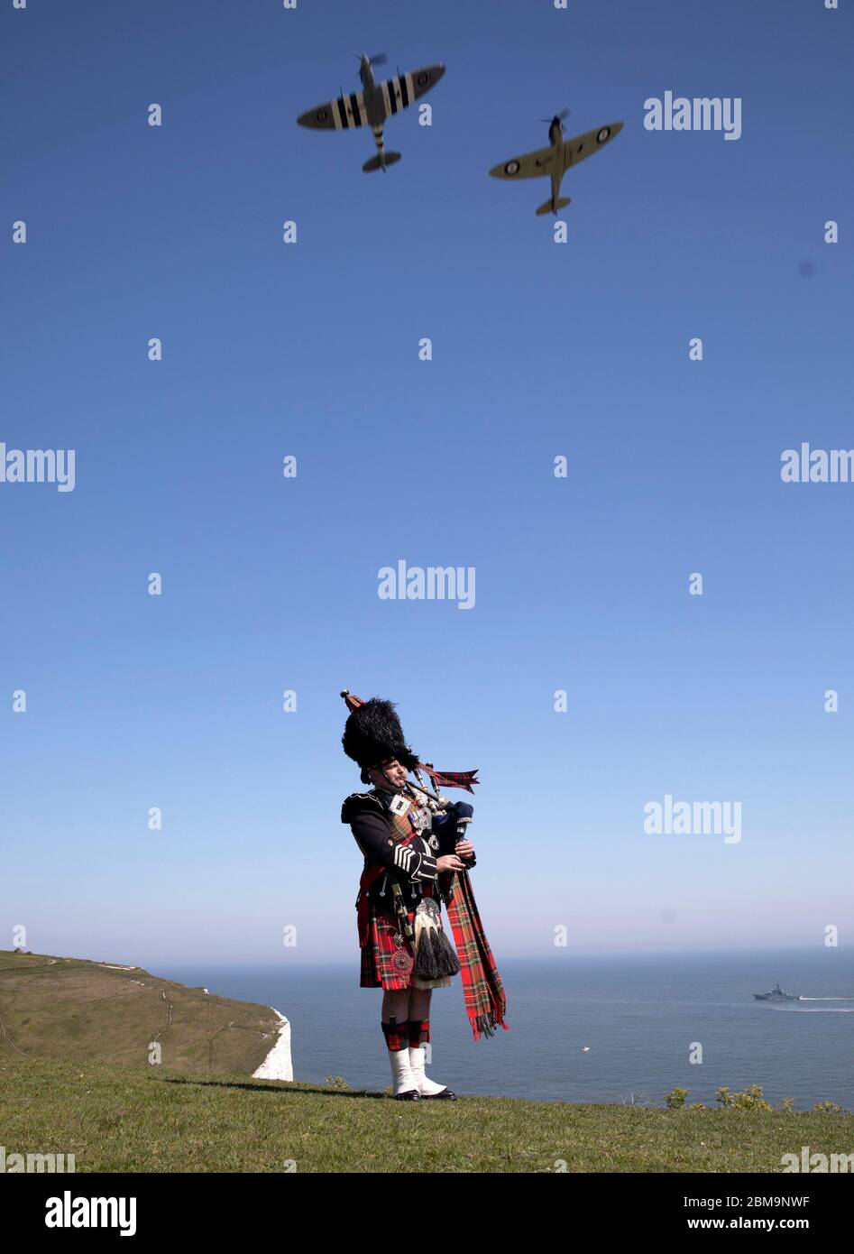 Pipe major Andy Reid of The Scots Guards plays his pipes on the cliffs ...