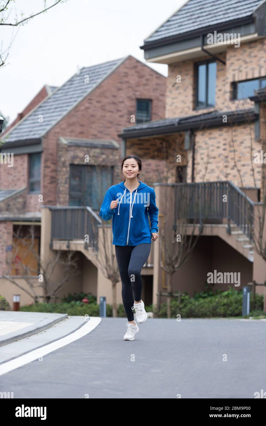 Modern asian woman running hi-res stock photography and images - Alamy