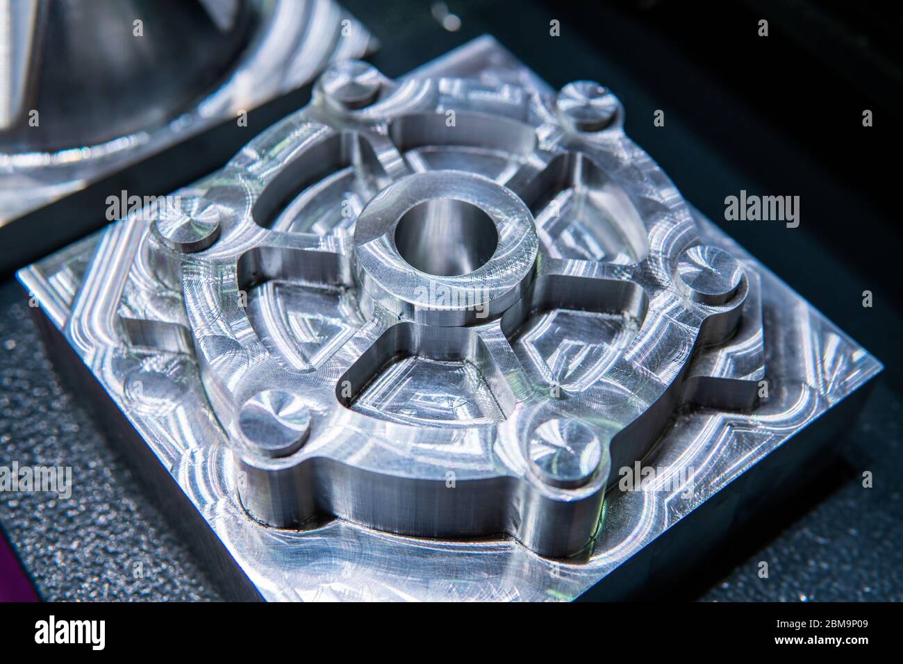Custom metal part manufactured in CNC milling machine Stock Photo - Alamy