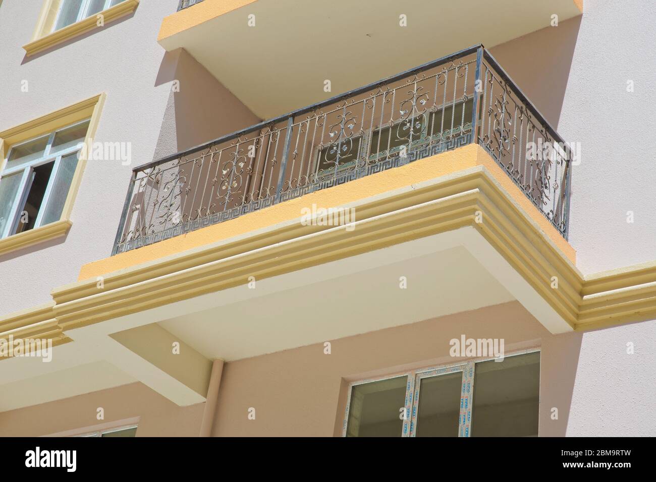 elegant decorative old stone balcony. low level perspective of multi ...