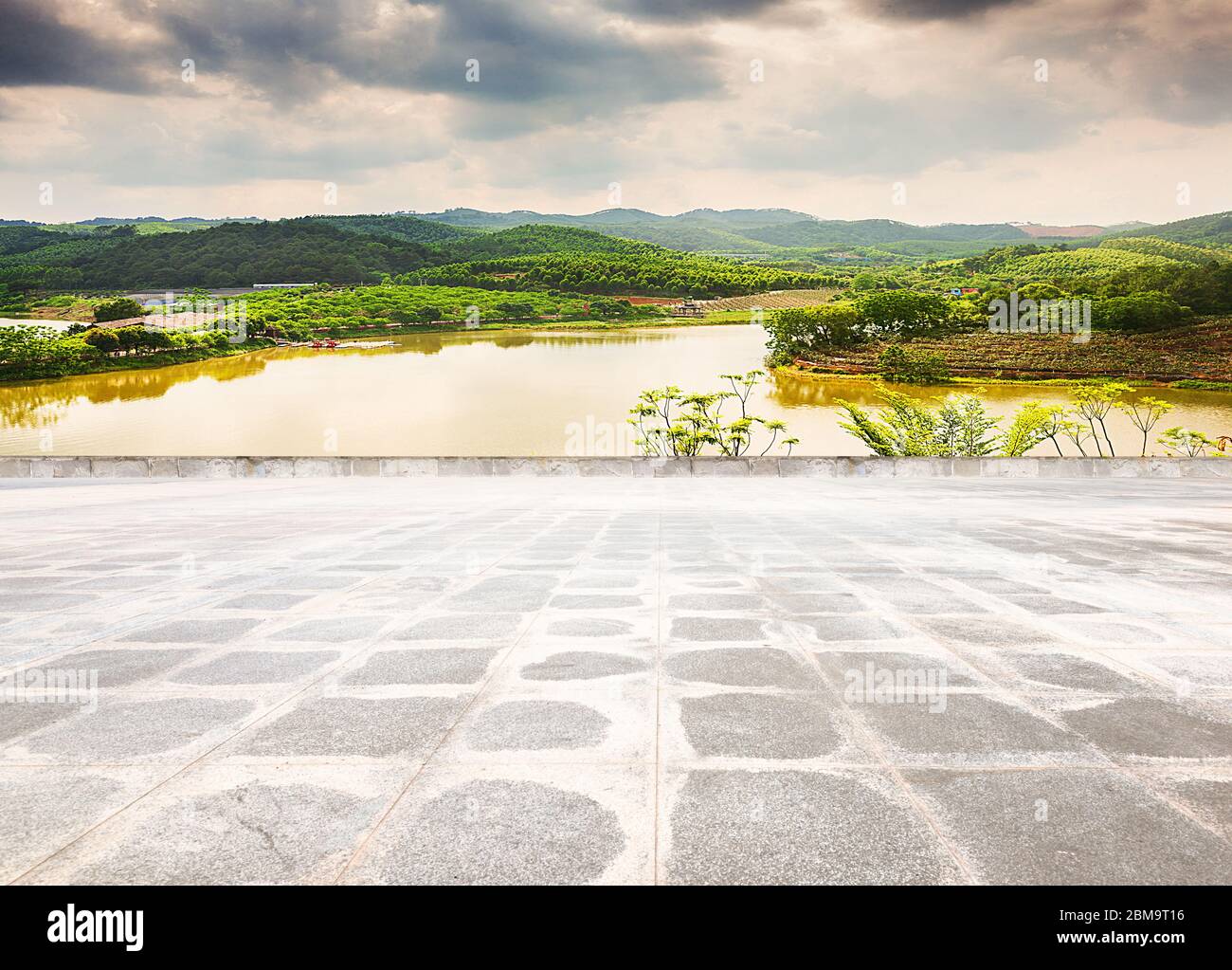 Unmanned floor tiles square platform and rural lake sunset landscape ...