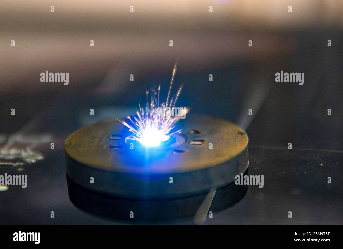 Evident action of the laser at engraving of a souvenir overlay Stock ...