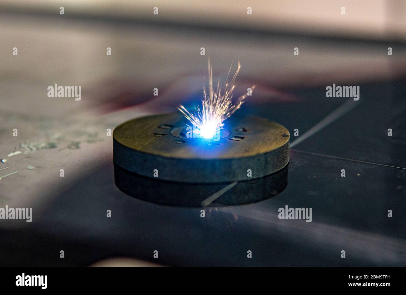 Evident action of the laser at engraving of a souvenir overlay Stock ...