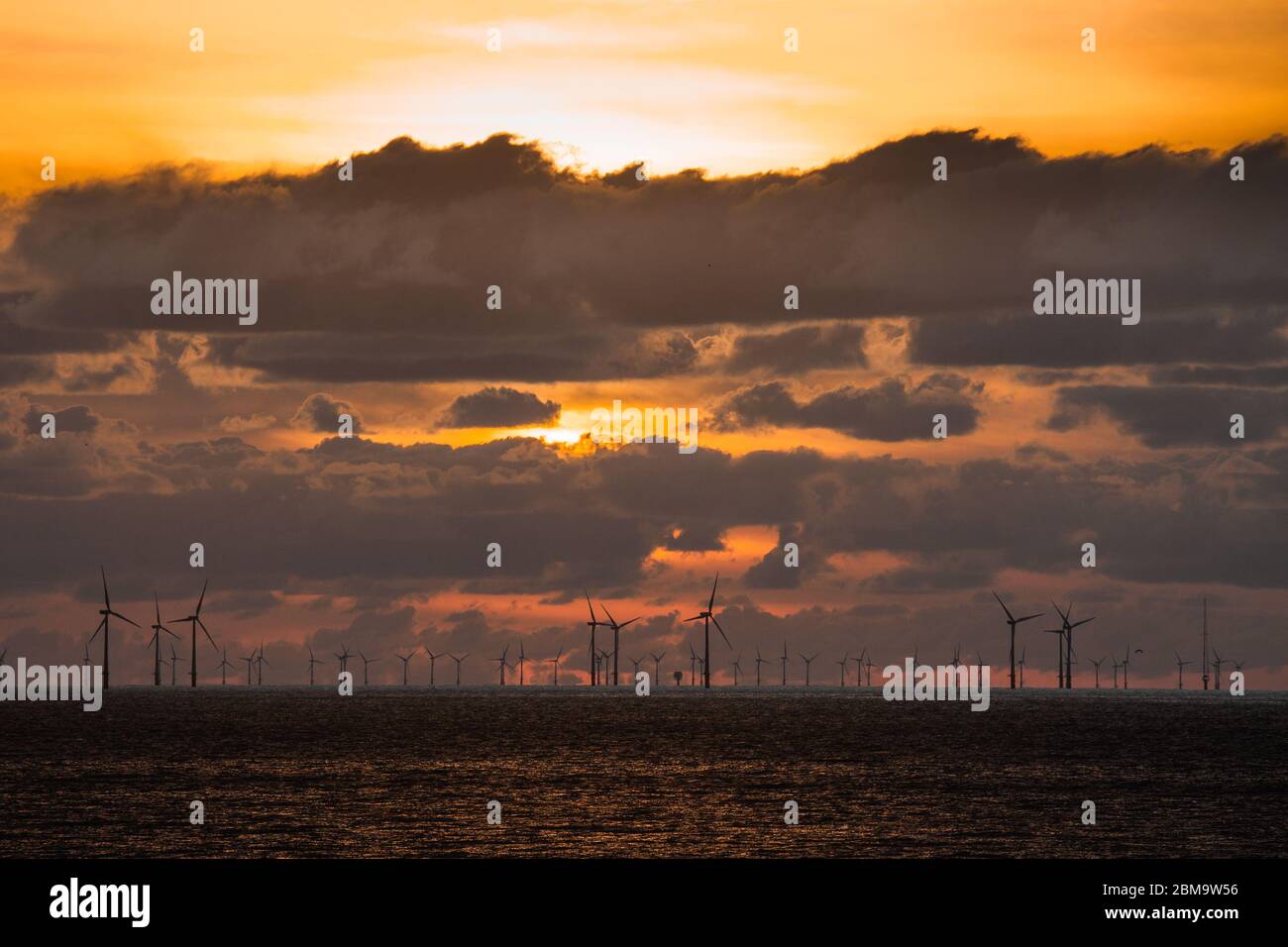 dark clouds over a wind farm in the north sea Stock Photo - Alamy