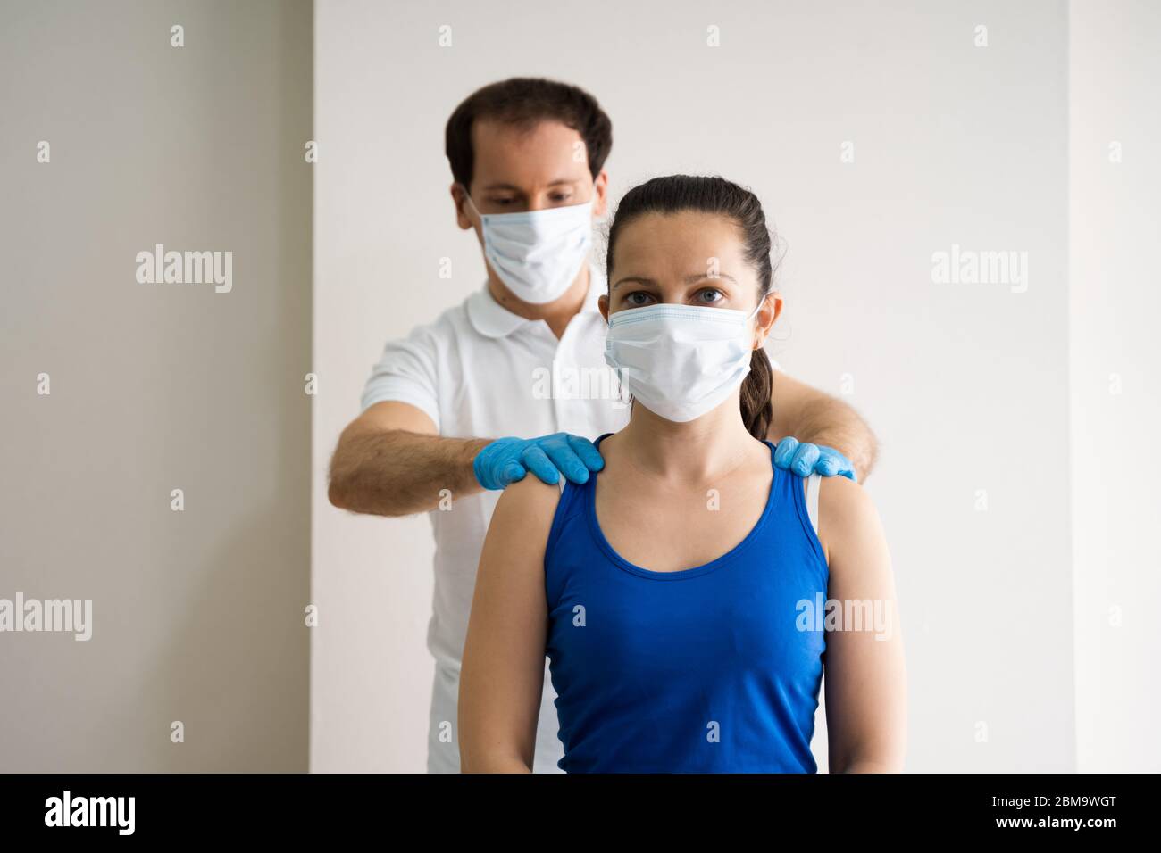 Doctor Giving Physio Massage To Patient After Injury Stock Photo - Alamy