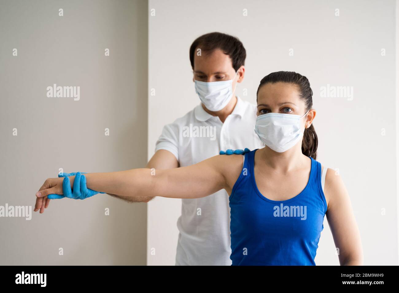 Doctor Giving Physio Massage To Patient After Injury Stock Photo - Alamy