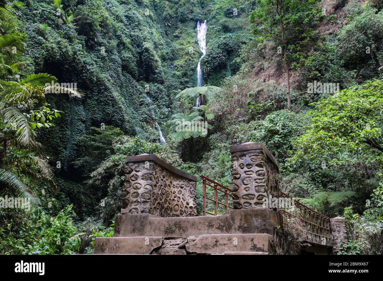 Stone bridge on path leading up the Madakaripura gorge in East Java ...