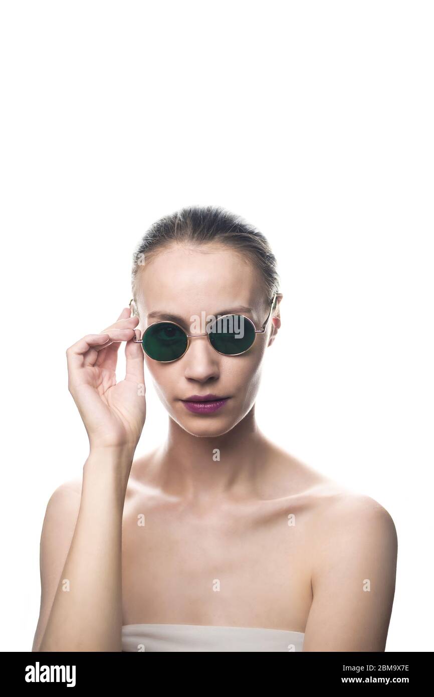 Fashion girl model in green sunglasses isolated on white background ...