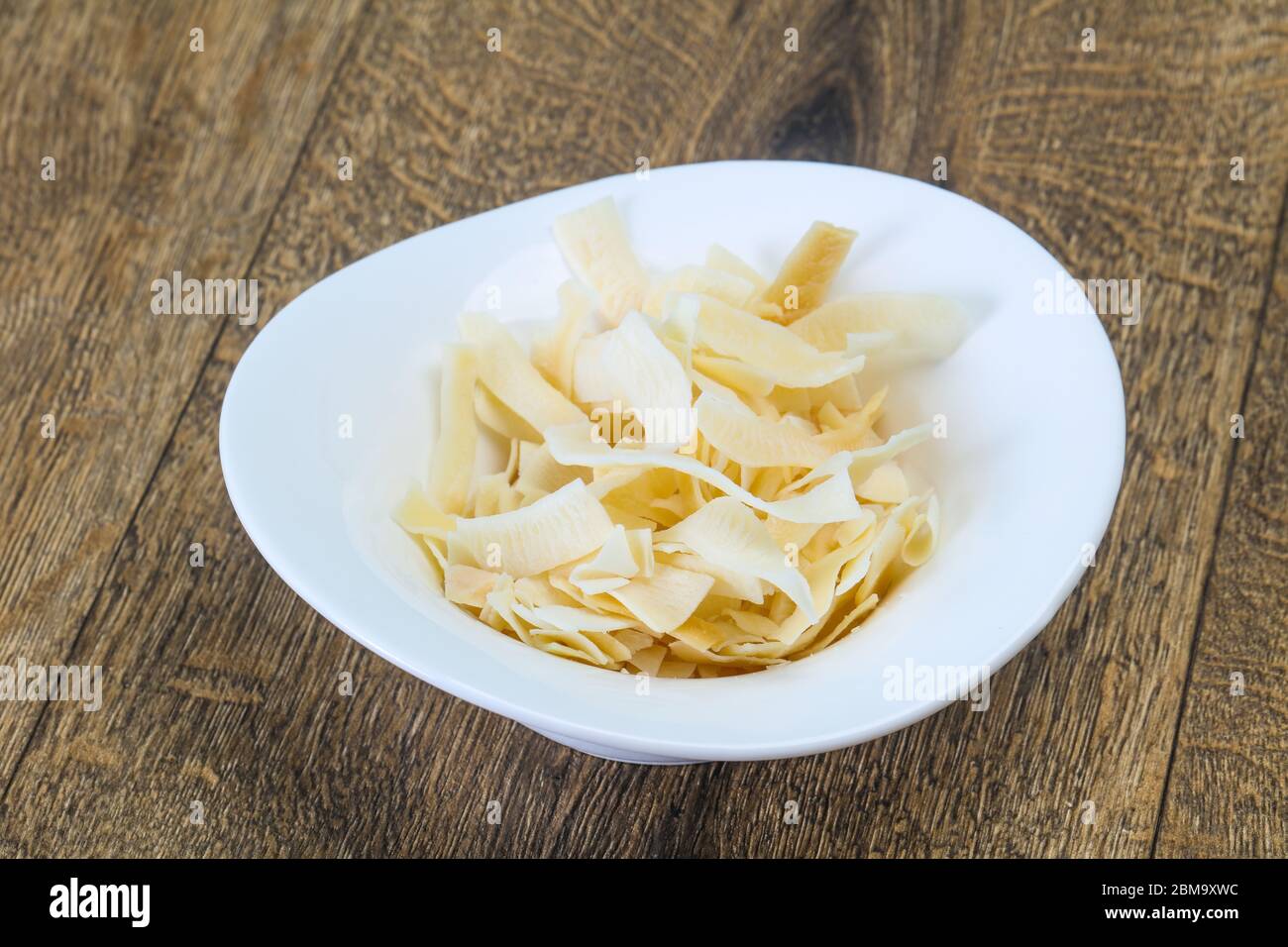 Coconut dry chips snack in the bowl Stock Photo - Alamy