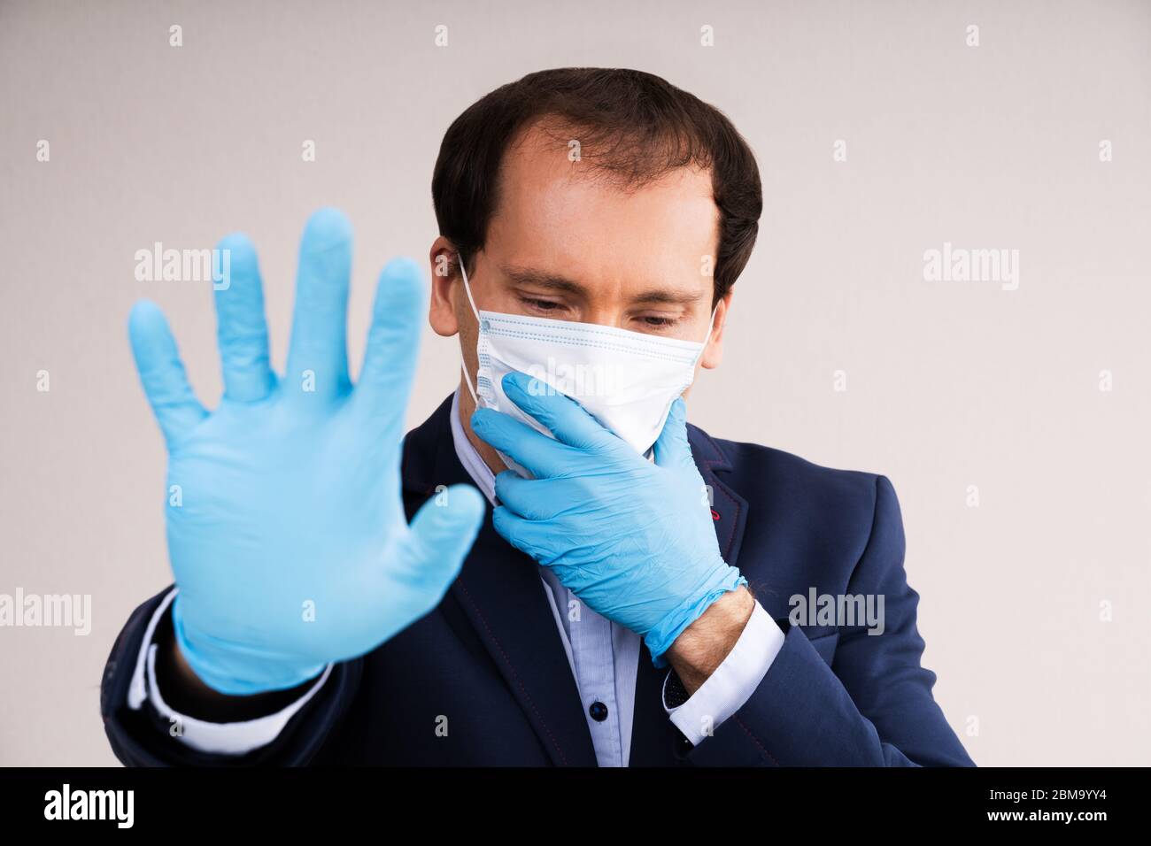 Man In Mask Suffering From Panic Attack And Shortness Of Breath Stock ...
