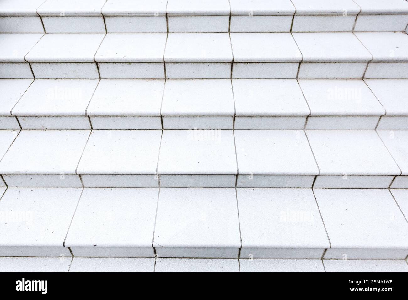 Stone granite white stairs. Textured background. Close up image Stock ...