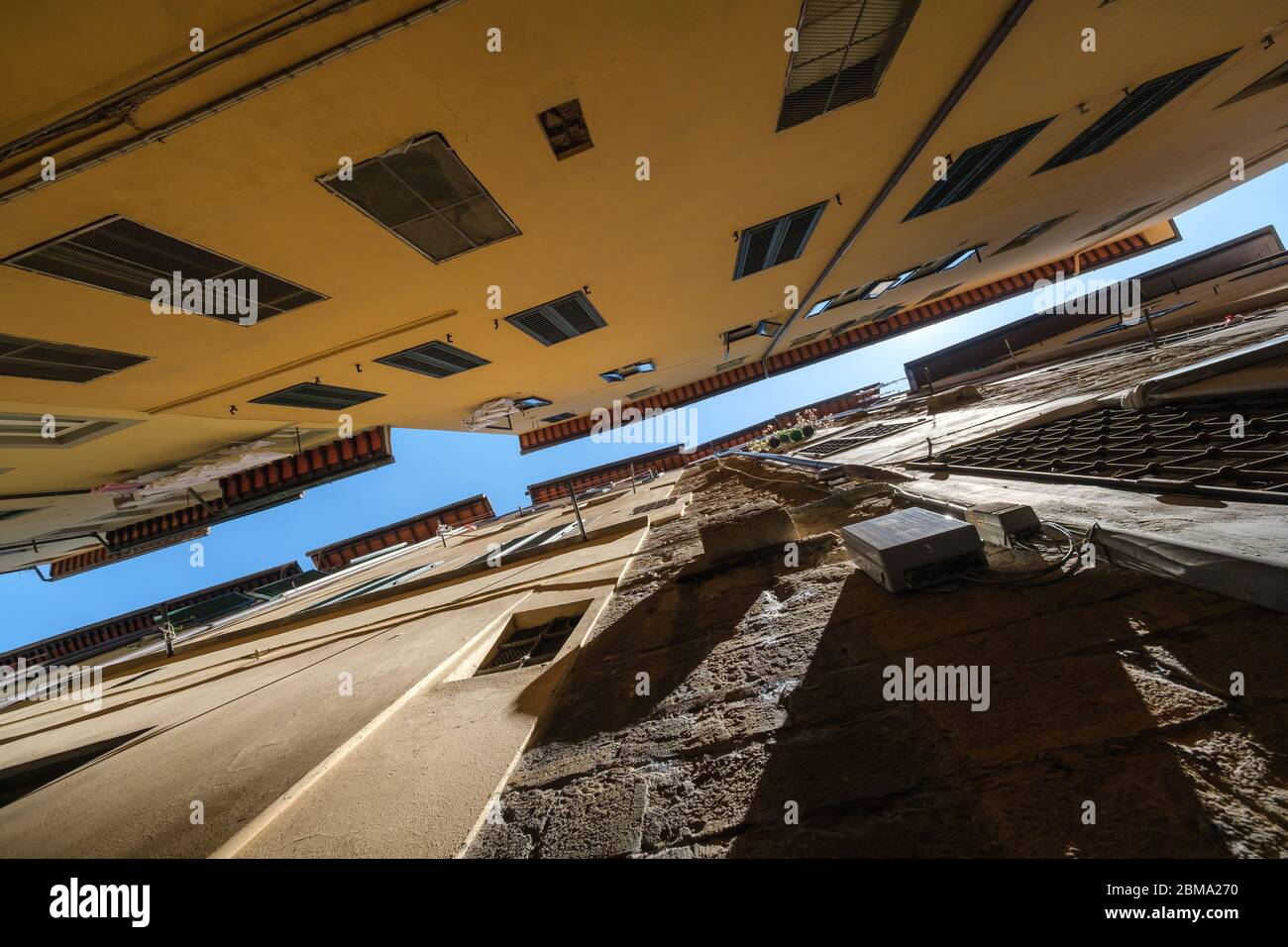 Narrow street view from the bottom up to the sky Stock Photo - Alamy
