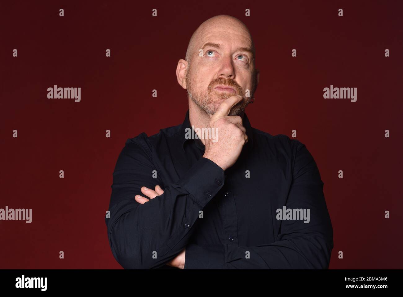 Man bald chin pensive hi-res stock photography and images - Alamy