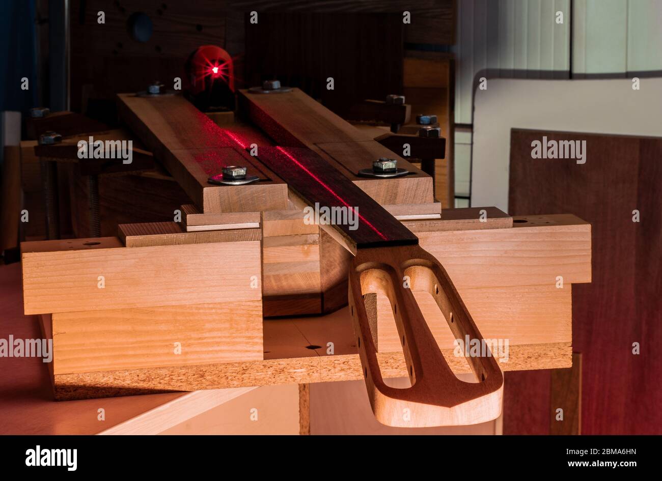 precision control with a laser straight level meter for assembly a neck ...