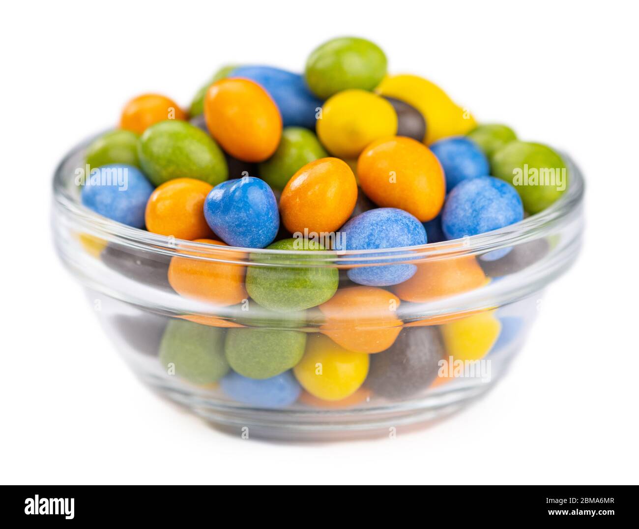 Chocolate coated peanuts isolated on white background (selective focus ...