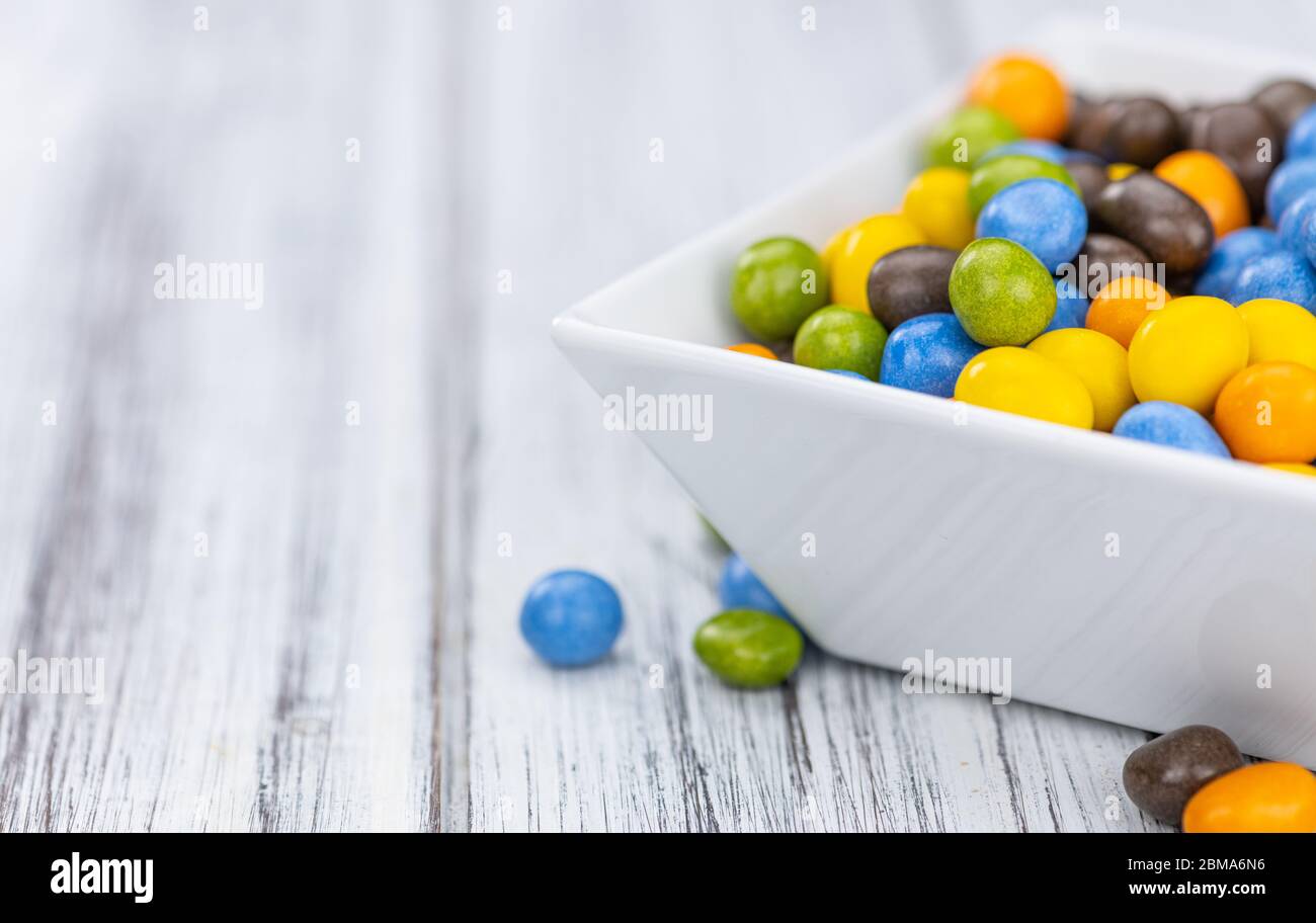 Chocolate coated peanuts as detailed close up shot (selective focus ...