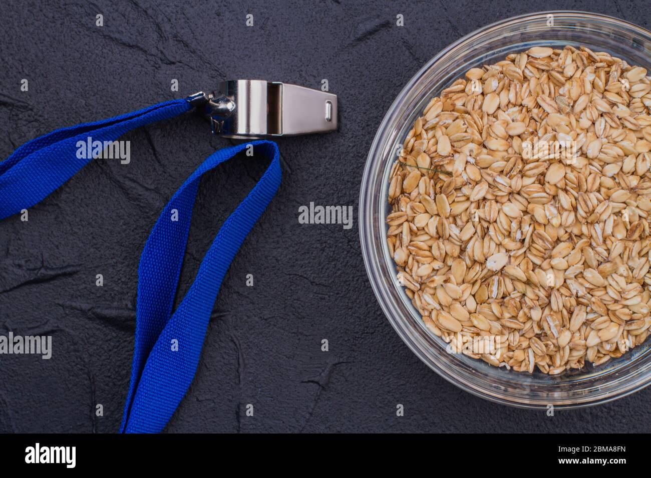 Dry oat grains portion and whistle Stock Photo - Alamy