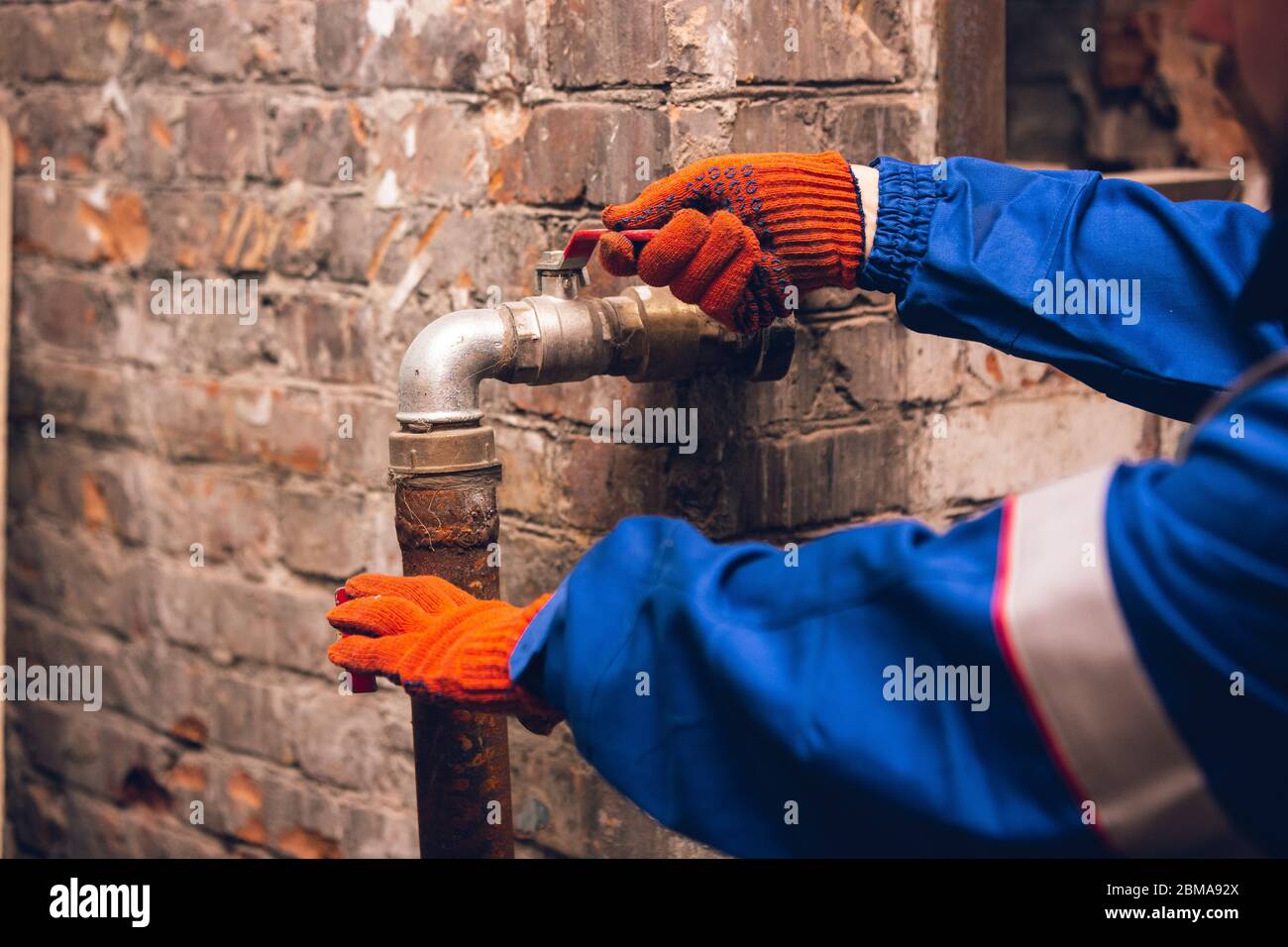 Closeup of repairman in uniform, professional builder working using ...