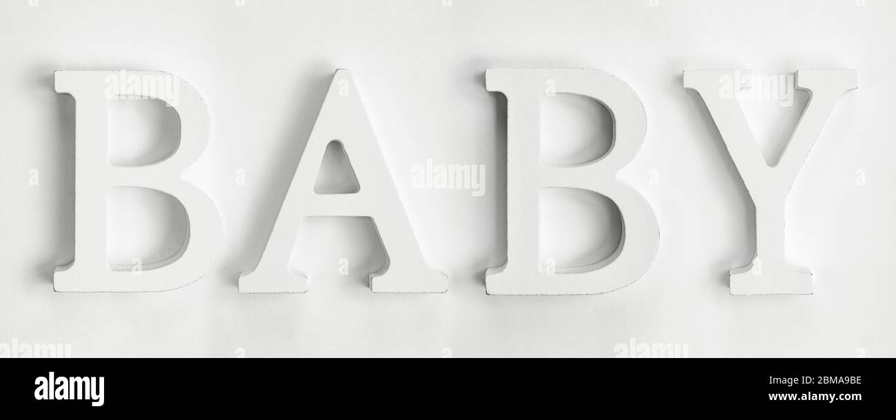 Word baby made of white wooden letters on white background Stock Photo ...