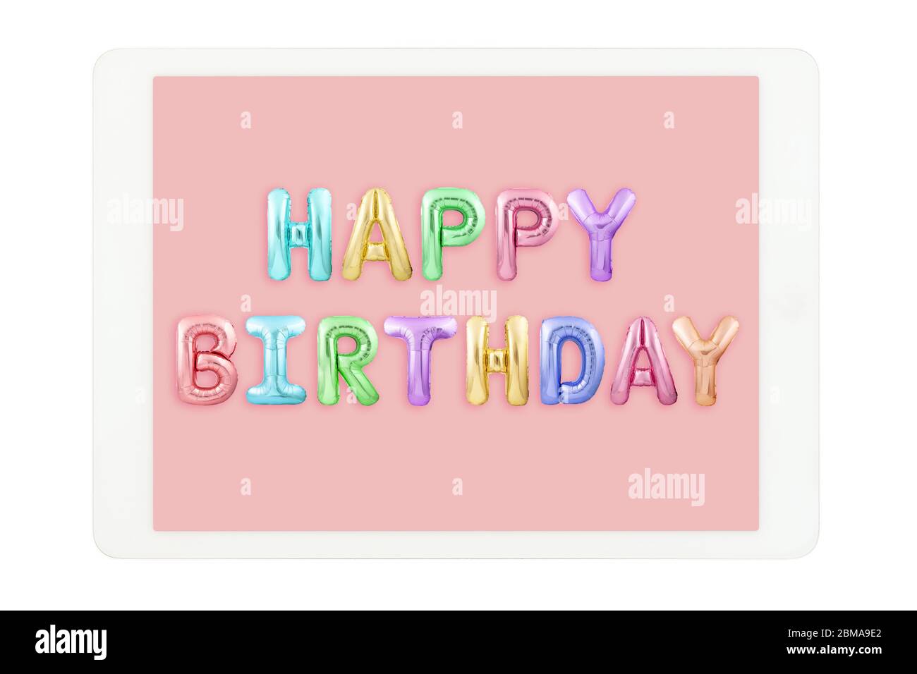 White tablet computer with colorful HAPPY BIRTHDAY words made of ...