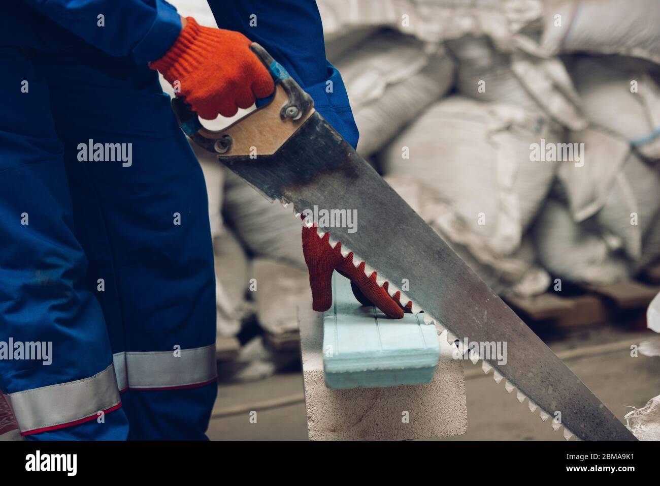 Closeup of repairman in uniform, professional builder working using ...