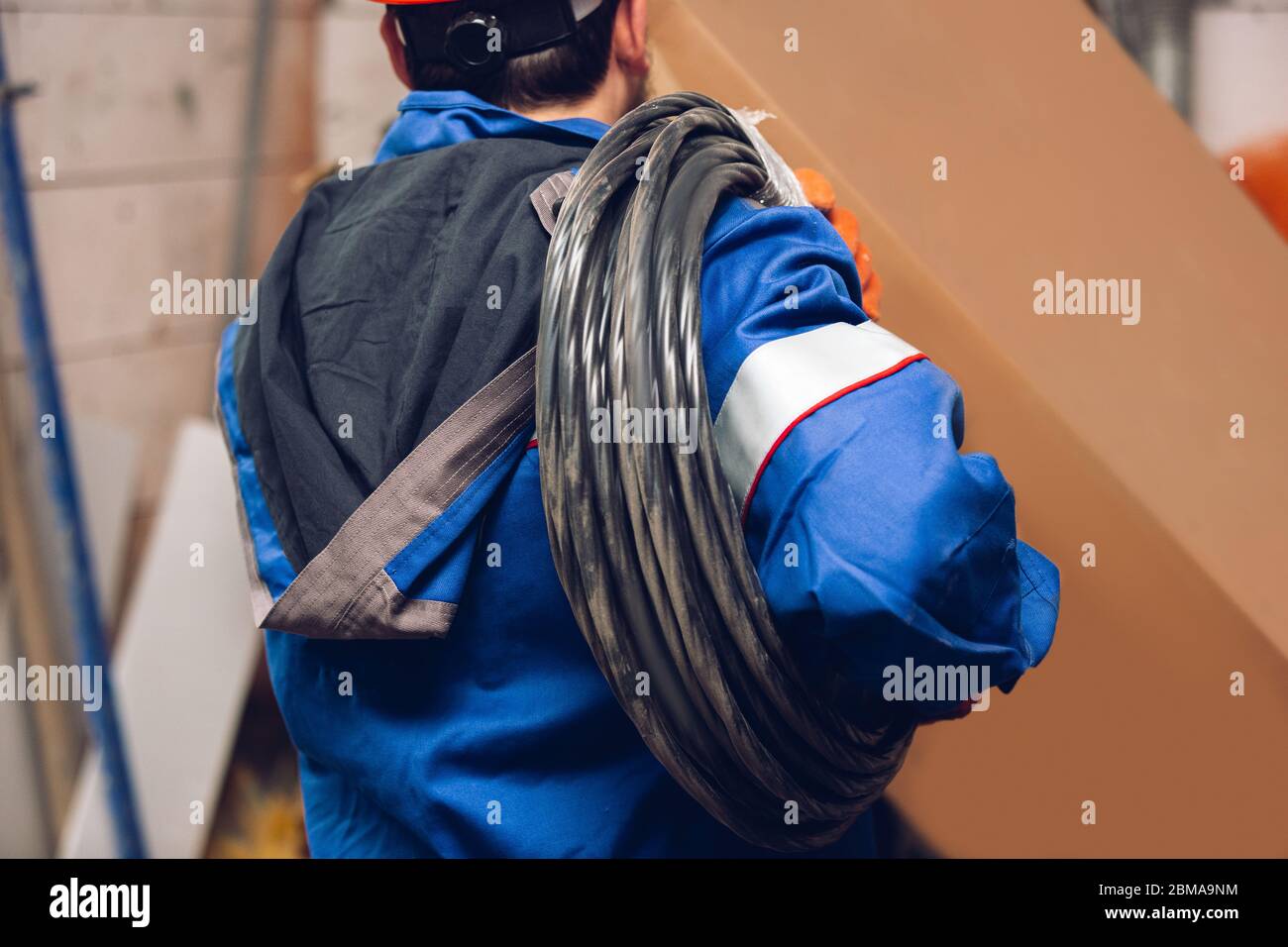 Closeup of repairman in uniform, professional builder working using ...