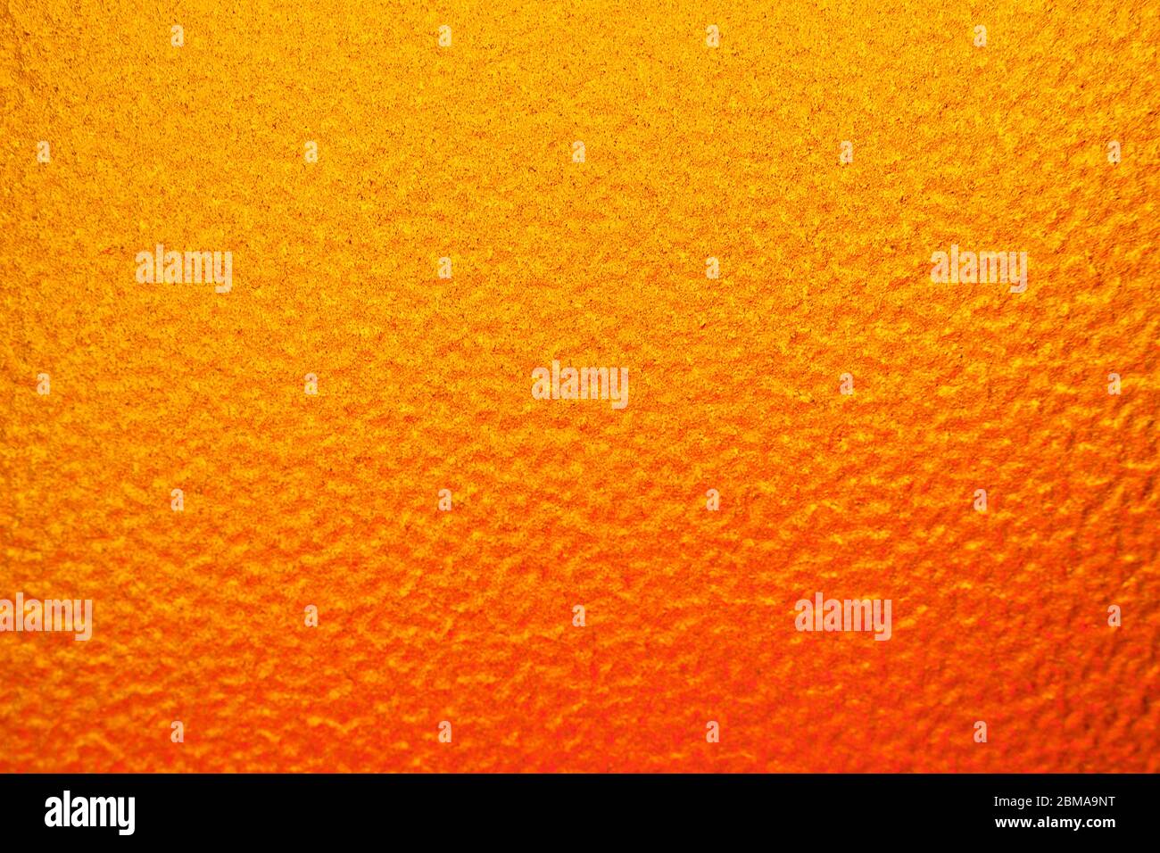 Horizontal image. The background that has only a slight orange shading ...