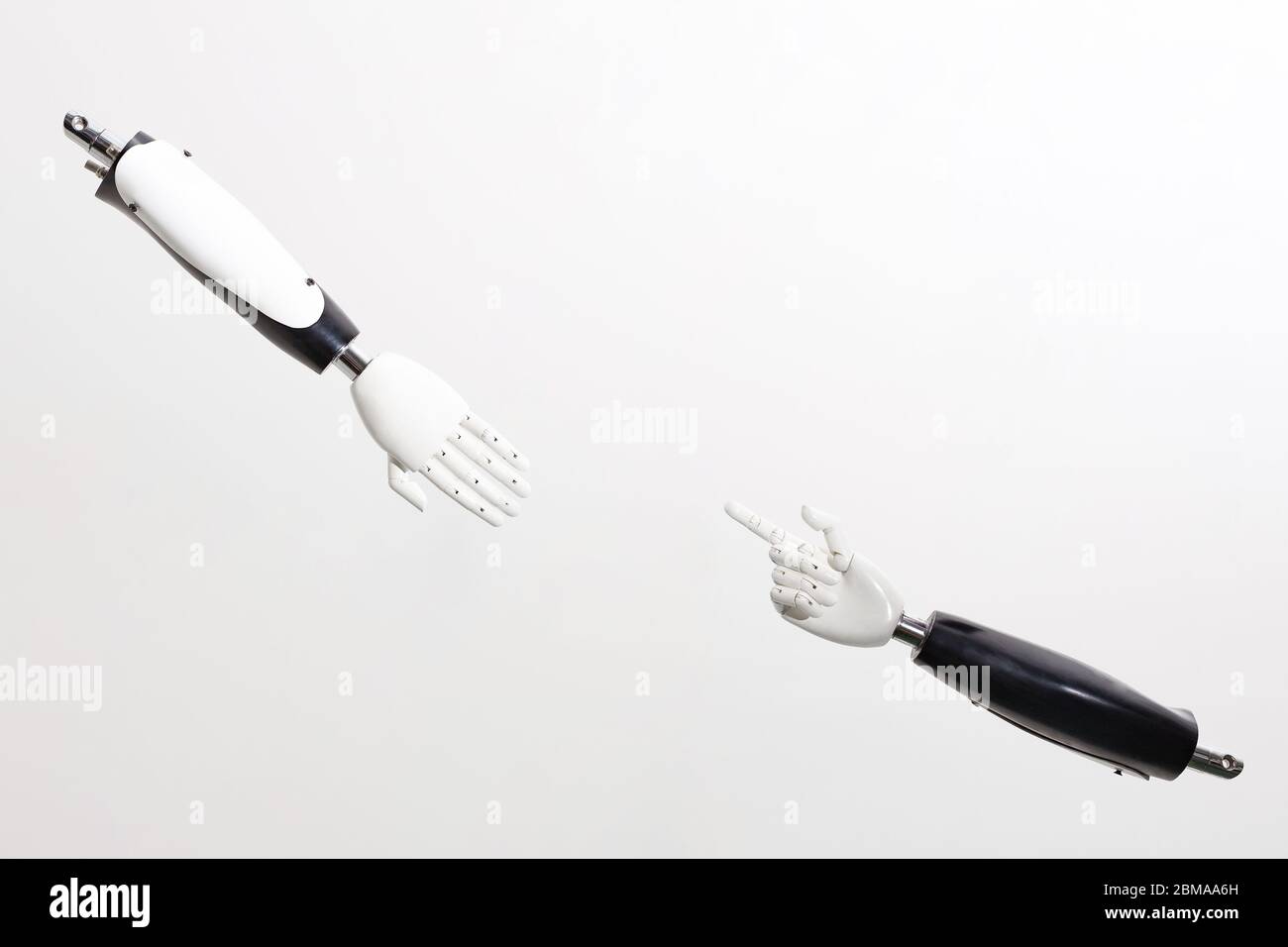 Outstretched robot hands on white background Stock Photo - Alamy