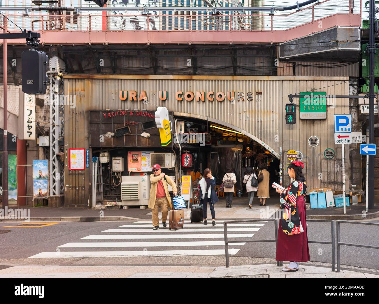 tokyo, japan - march 25 2020: Japanese woman in hakama kimono reading a ...