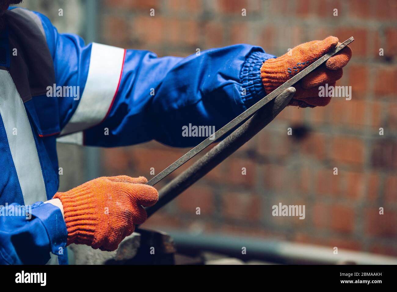Closeup of repairman in uniform, professional builder working using ...