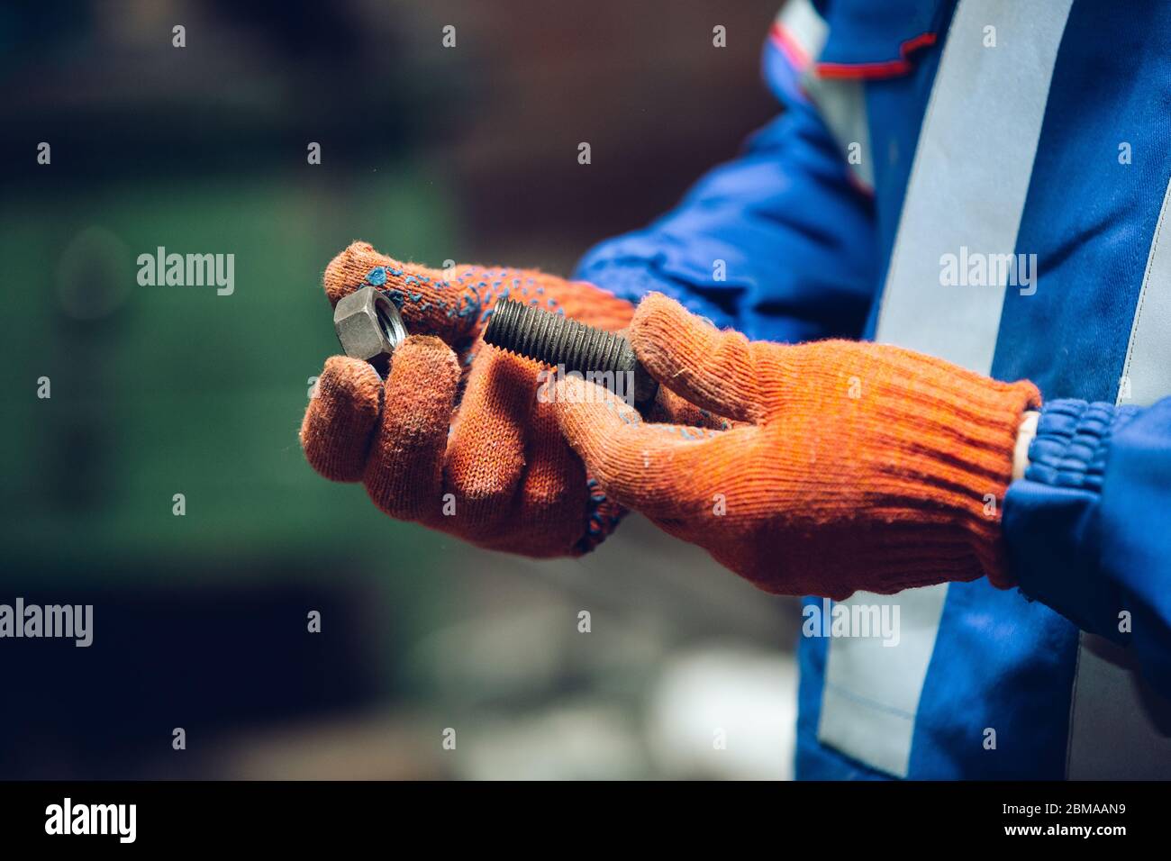 Closeup of repairman in uniform, professional builder working using ...
