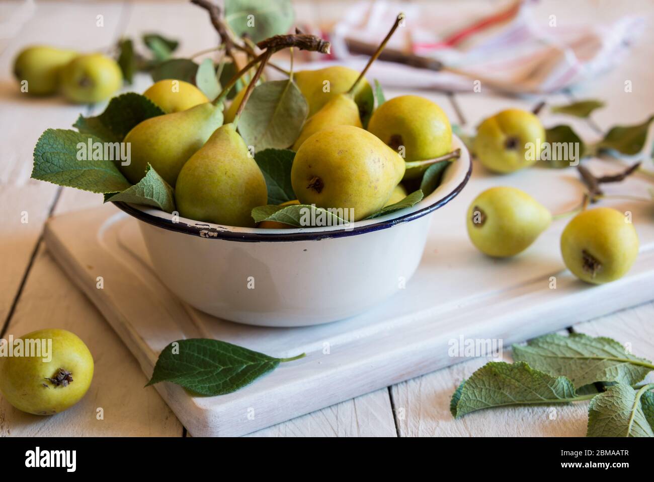 Fresh organic pears fruits with leaves on white wood Stock Photo - Alamy