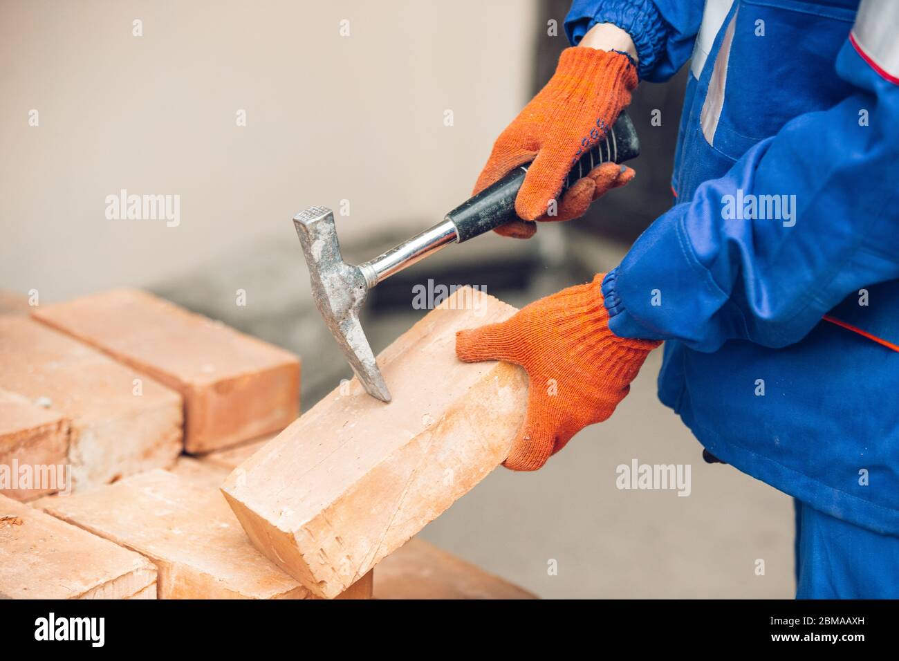 Closeup of repairman in uniform, professional builder working using ...