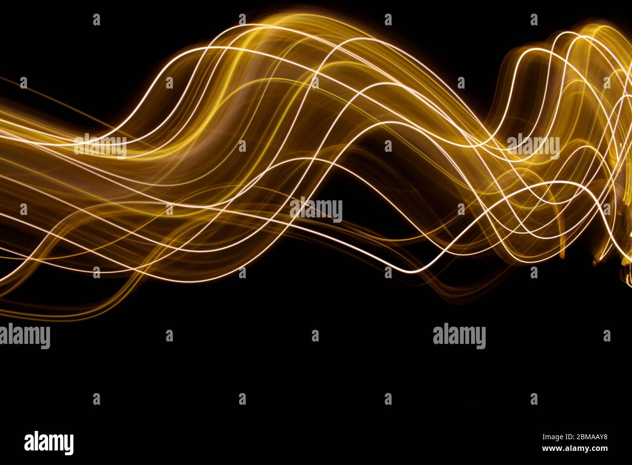 Long exposure photograph of neon colour in an abstract swirl, parallel ...