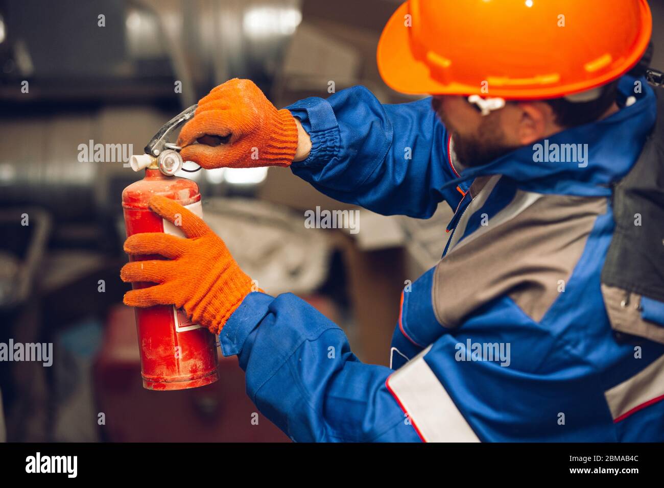 Closeup of repairman in uniform, professional builder working using ...