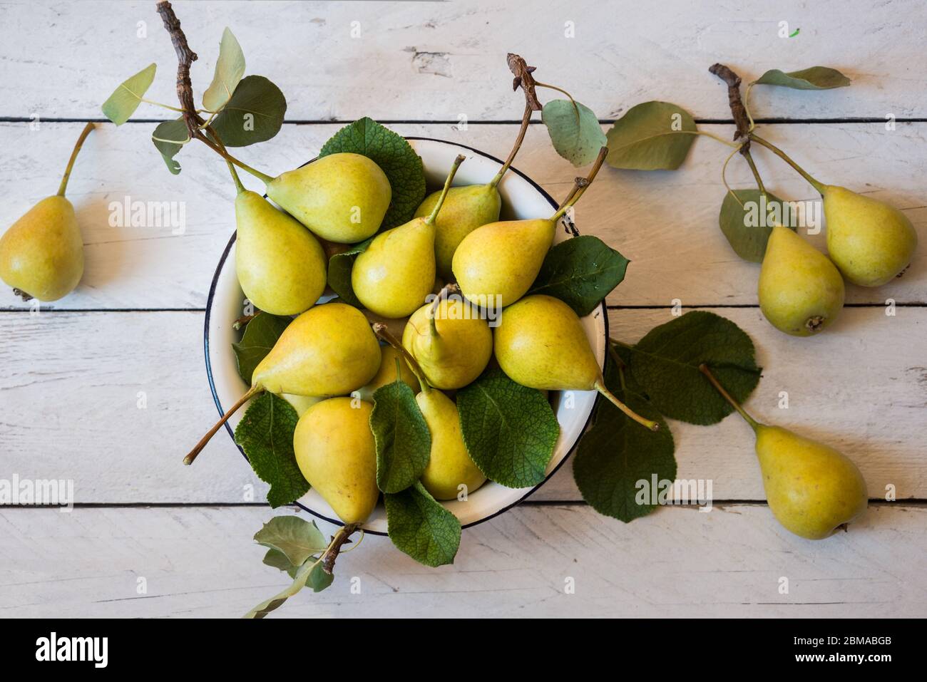 Fresh organic pears fruits with leaves on white wood Stock Photo - Alamy