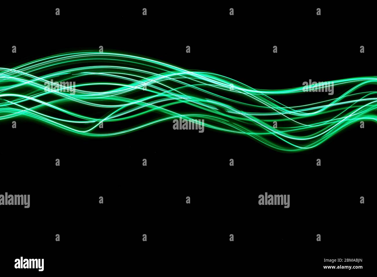 Long exposure photograph of neon colour in an abstract swirl, parallel ...